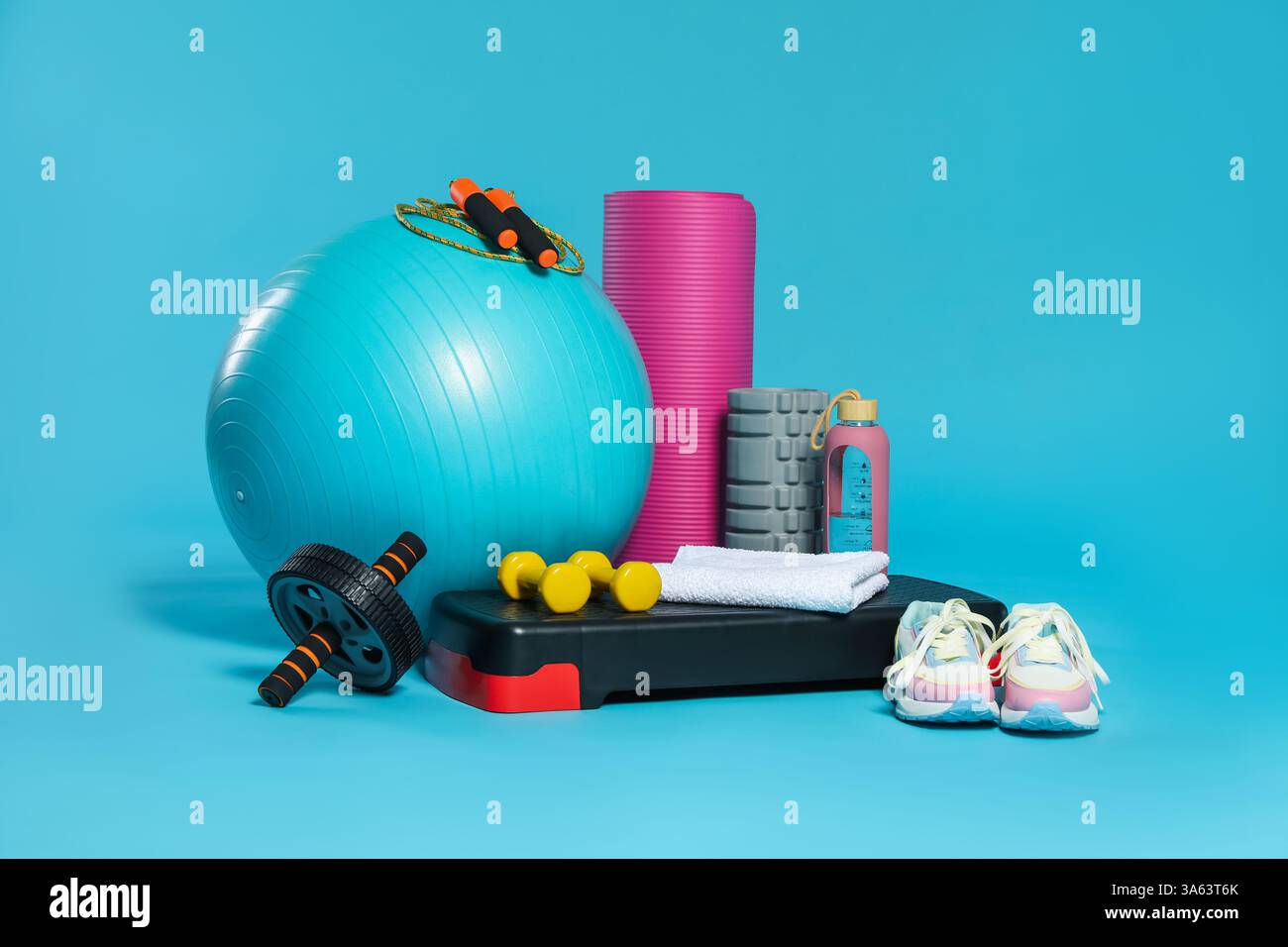 Many different fitness equipment on light blue background Stock Photo ...