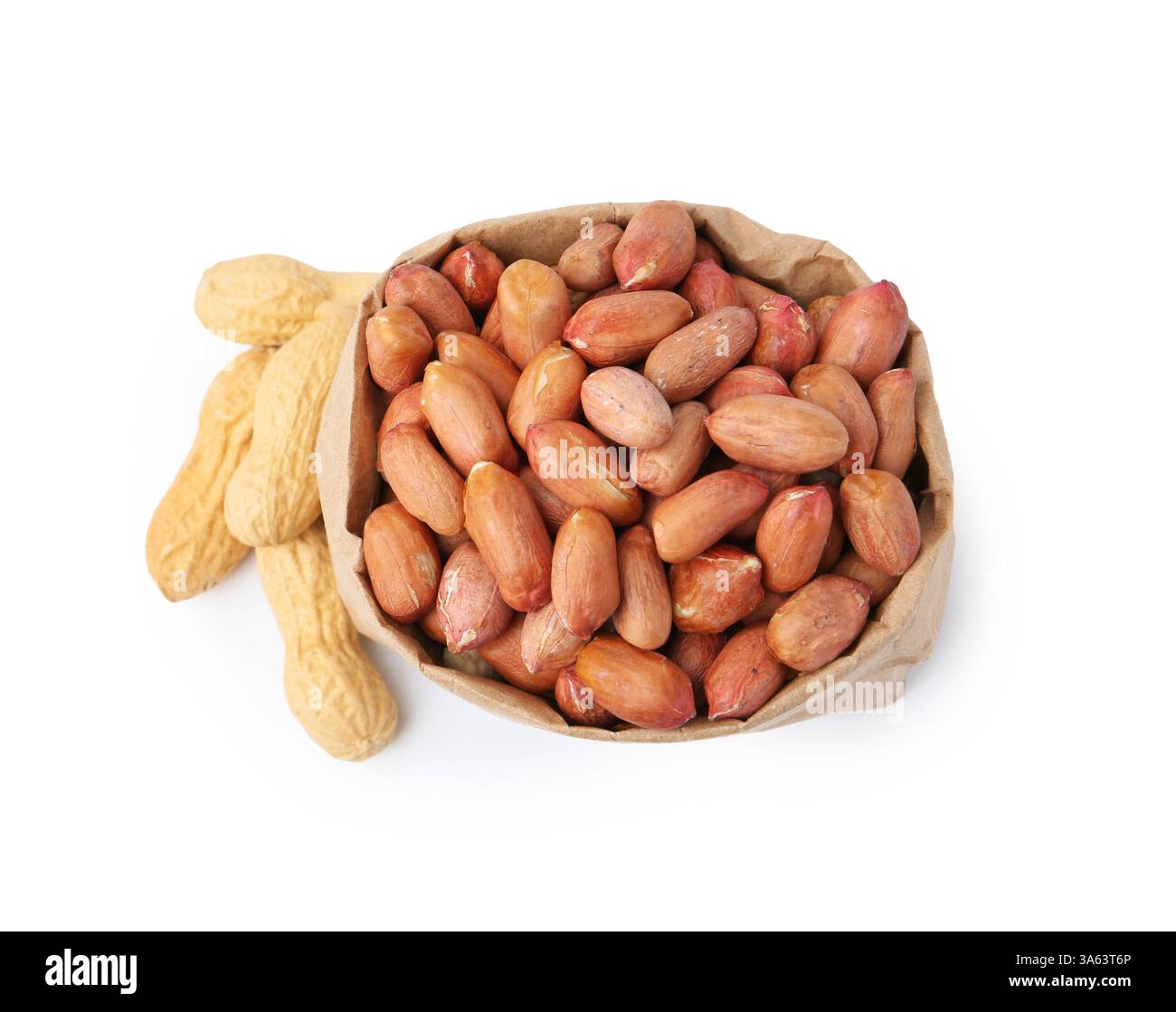 Fresh peanuts in paper bag and unpeeled ones isolated on white, top ...