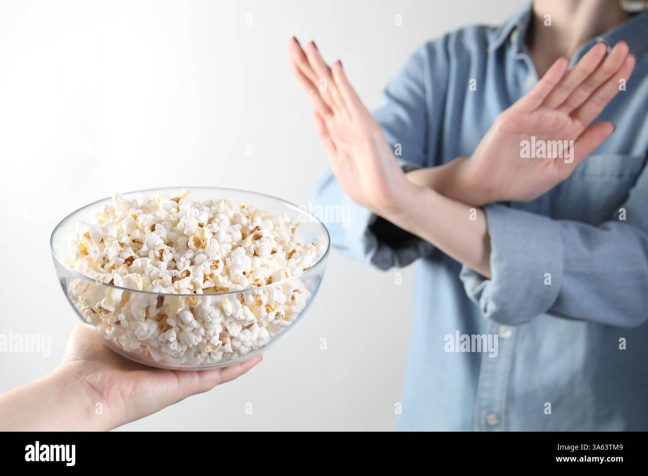 Woman refusing popcorn on hi-res stock photography and images - Alamy