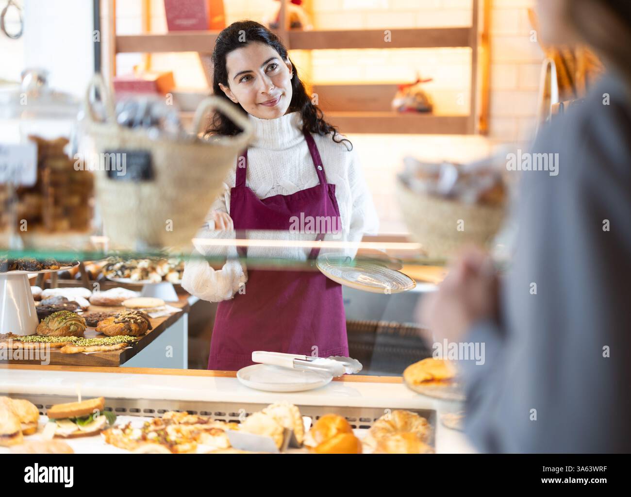 Girl saleswoman works in cafeteria bakery shop Stock Photo - Alamy