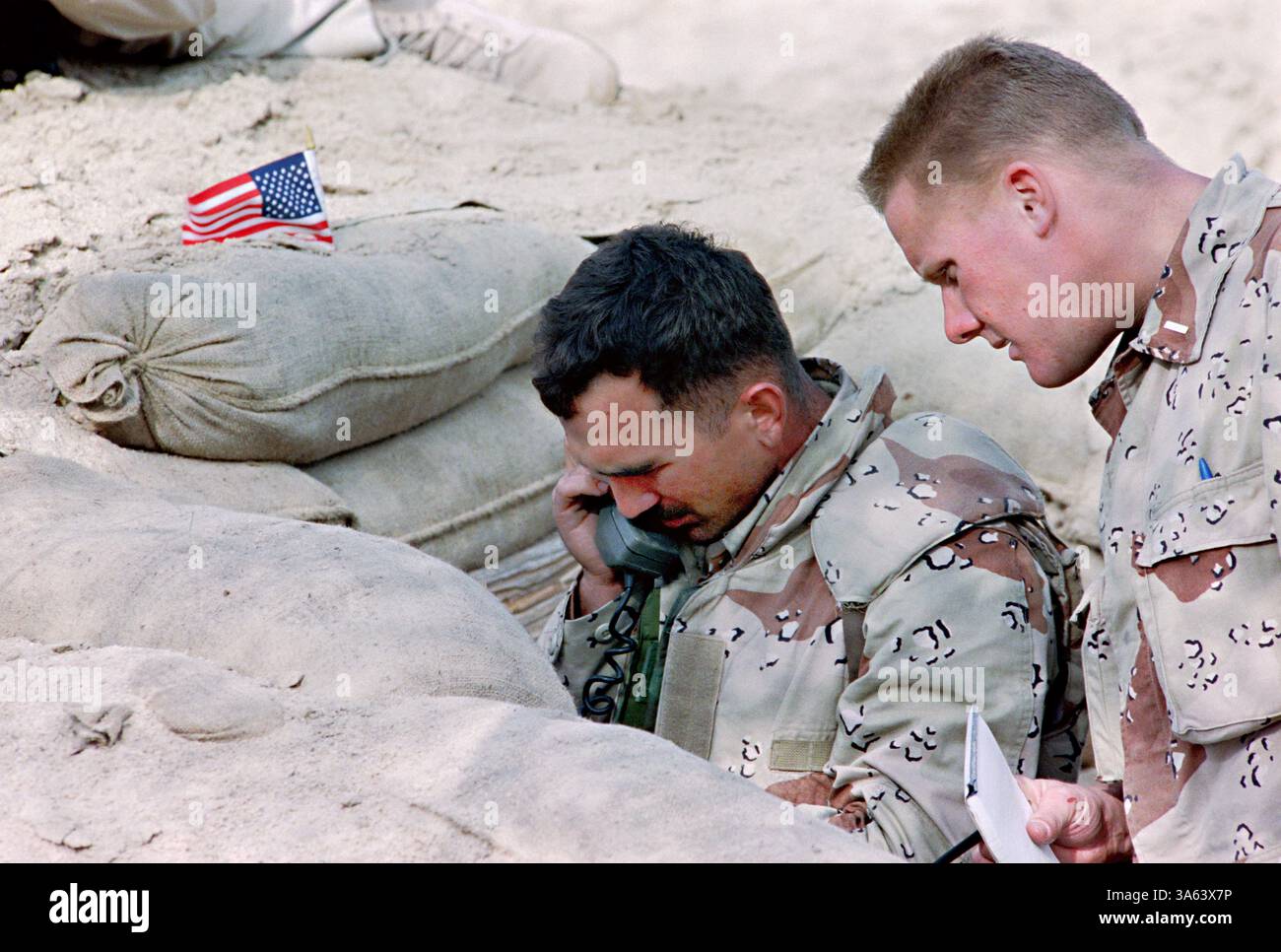 A U.S Marines reconnaissance unit receives coordinates from command ...