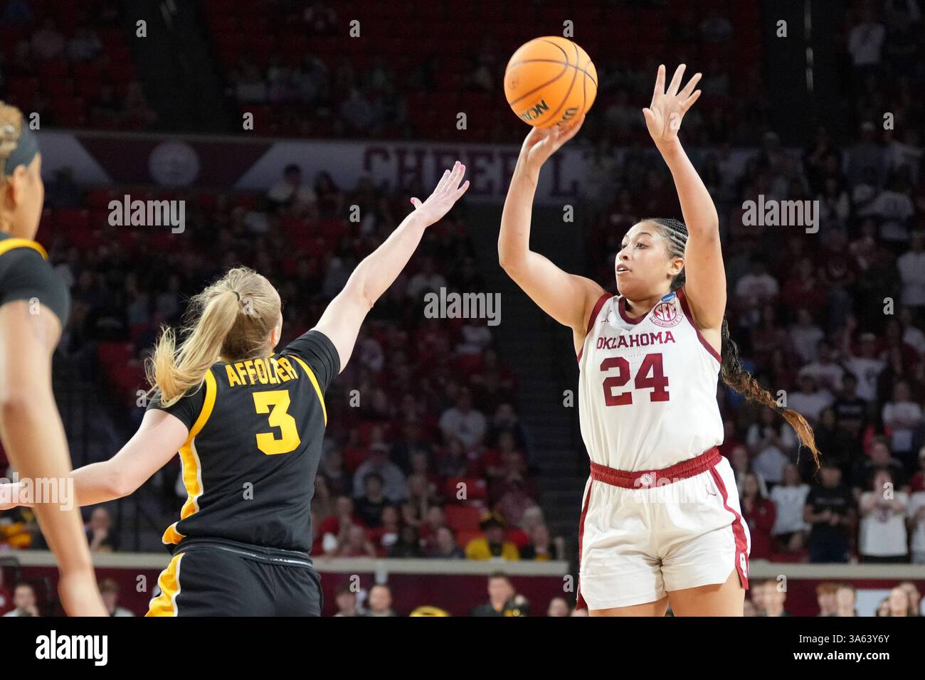 Oklahoma forward Skylar Vann (24) shoots over Iowa guard Sydney ...