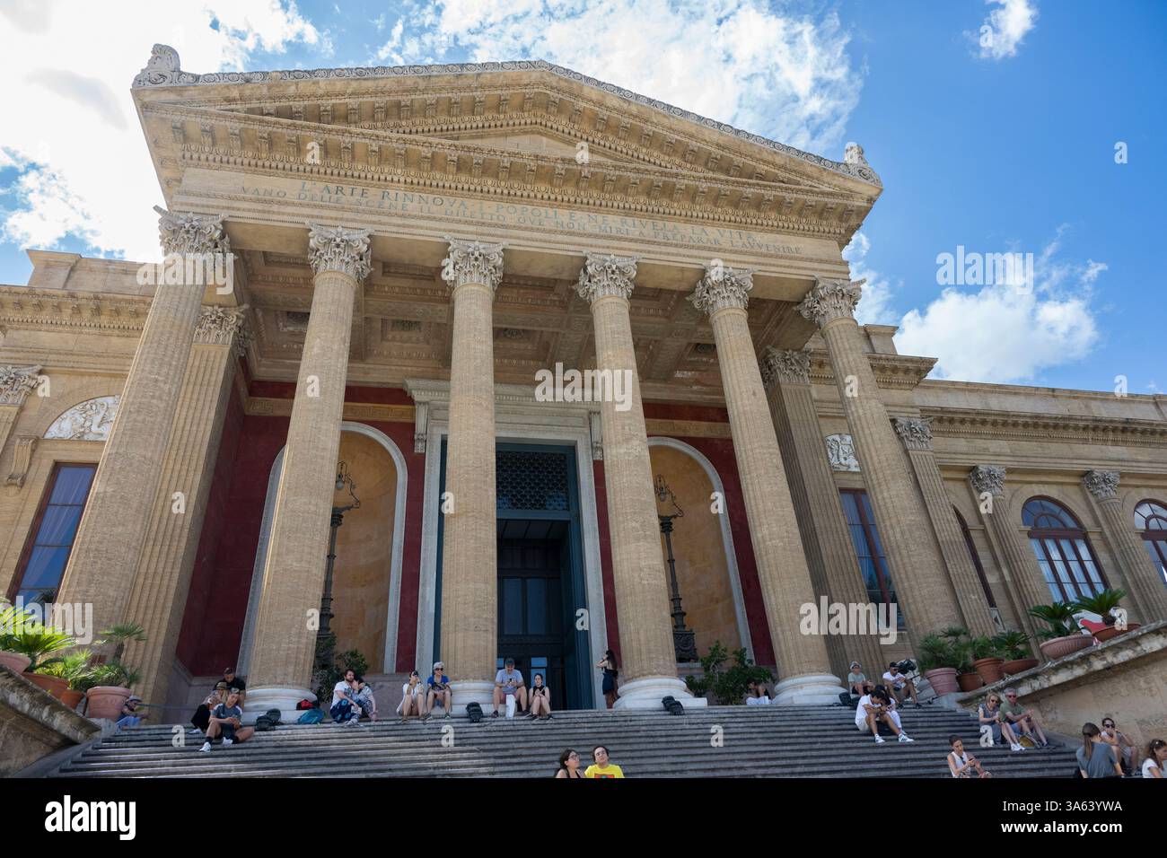 Front view of people seated on the stairway leading to the famed grand ...