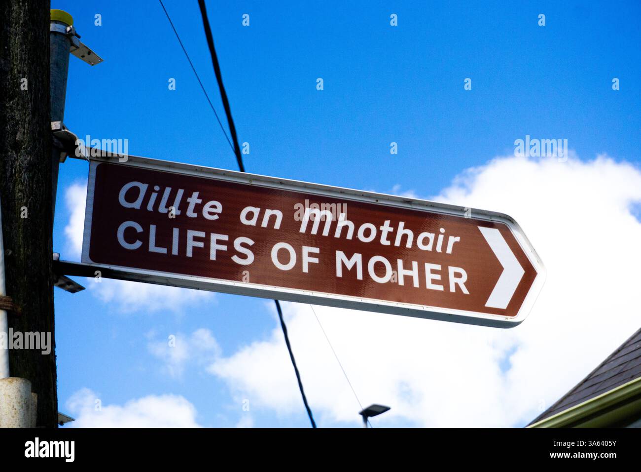 Cliffs of Moher Sign in Ireland Standing Alone Under a Cloudy Blue Sky ...