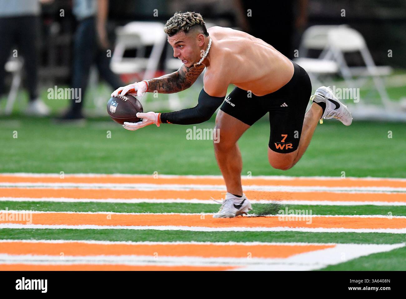 Miami receiver Xavier Restrepo catches a ball during the school's NFL ...