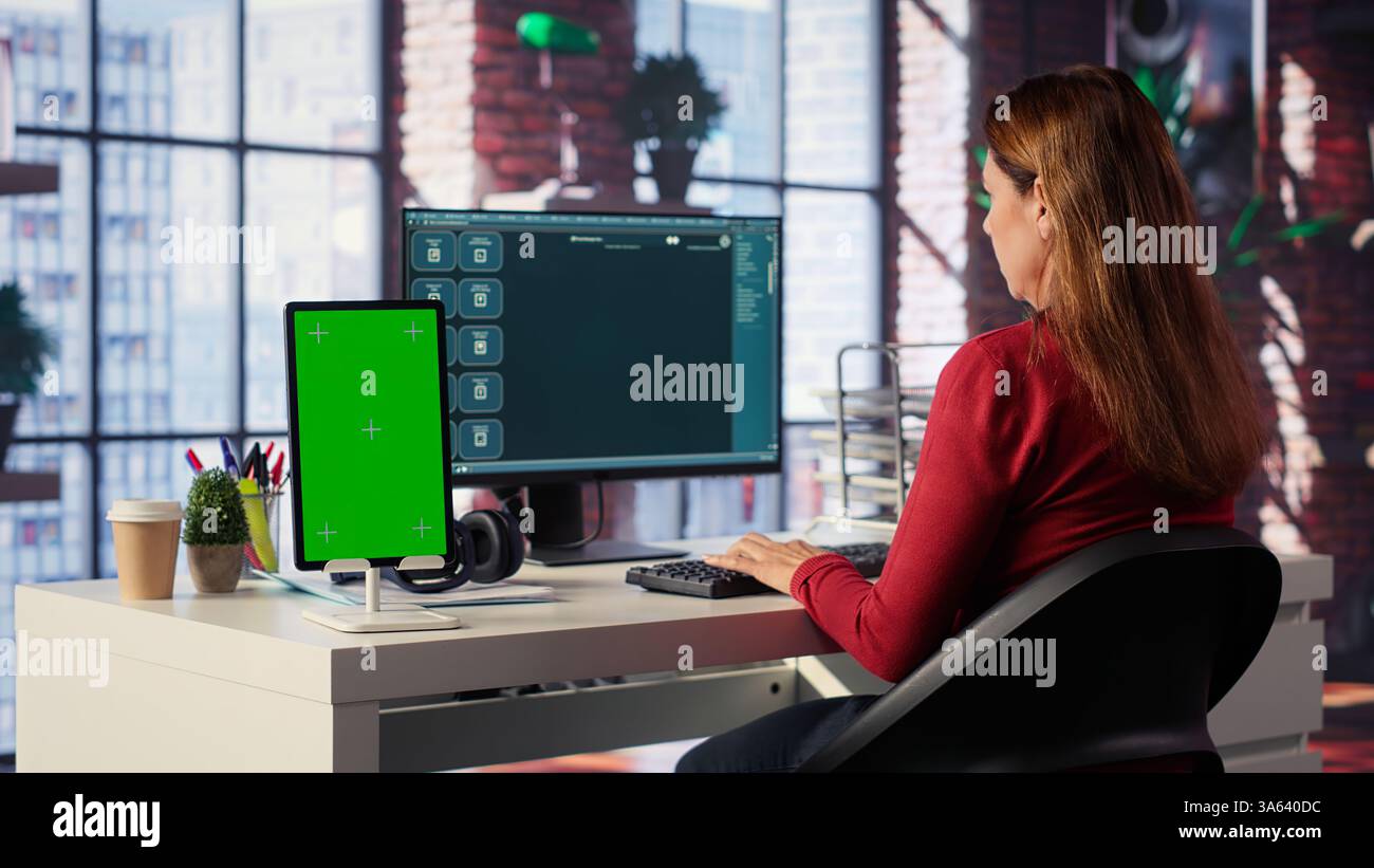 Freelancer interacting with smart AI virtual assistant next to mockup screen, using innovative ...