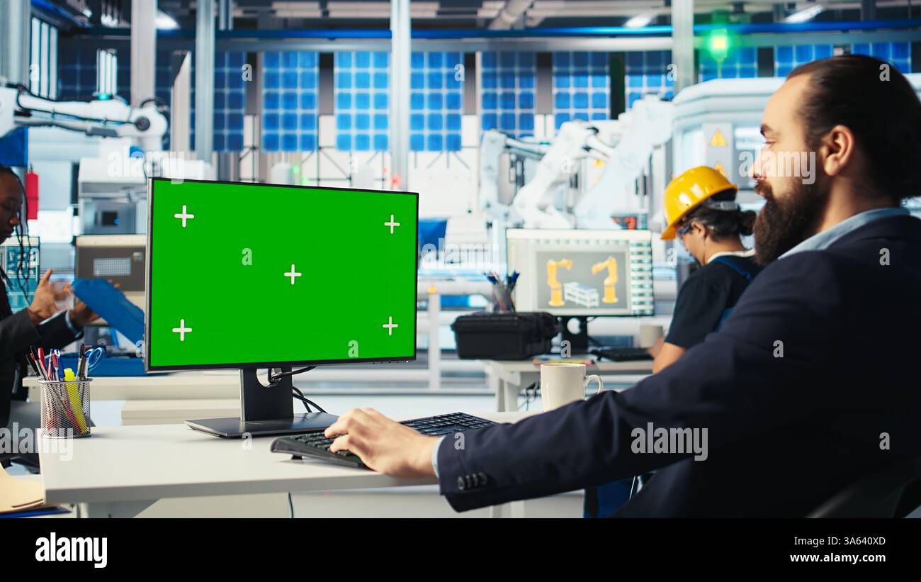 Engineer In Photovoltaics Factory Using Chroma Key Computer To Diagnose Malfunctioning Systems