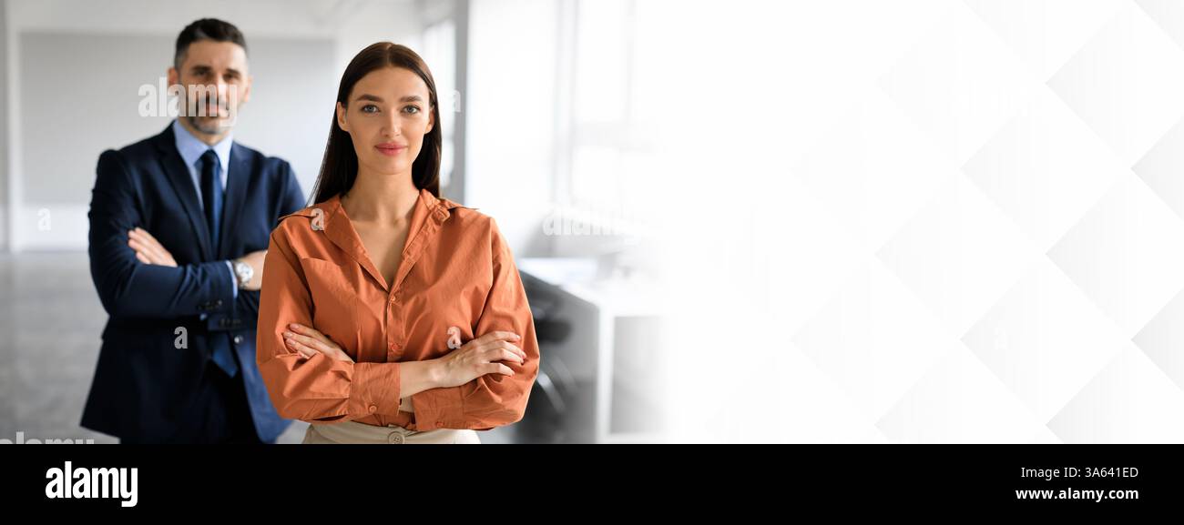 Two business leaders posing with folded arms and looking at camera ...