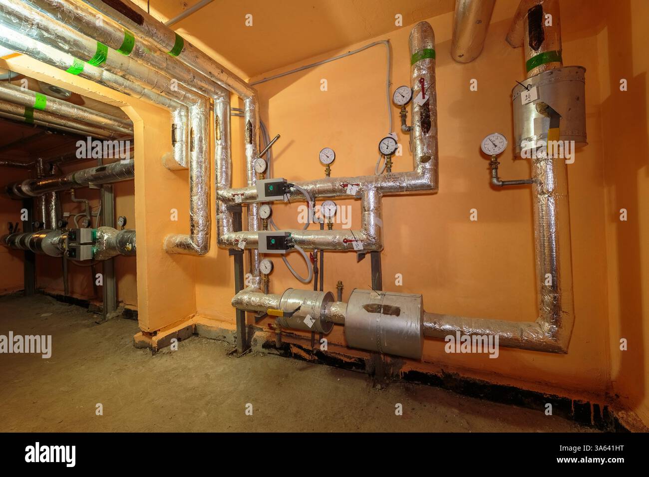 Technical pipes for sewerage in the basement of a building with ...