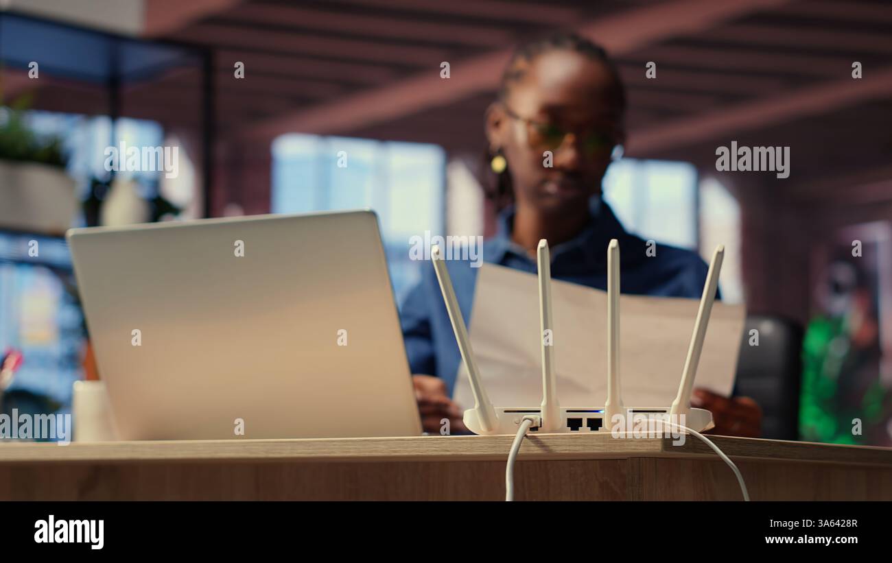 Young woman struggling with weak internet connection at home, pulling ...