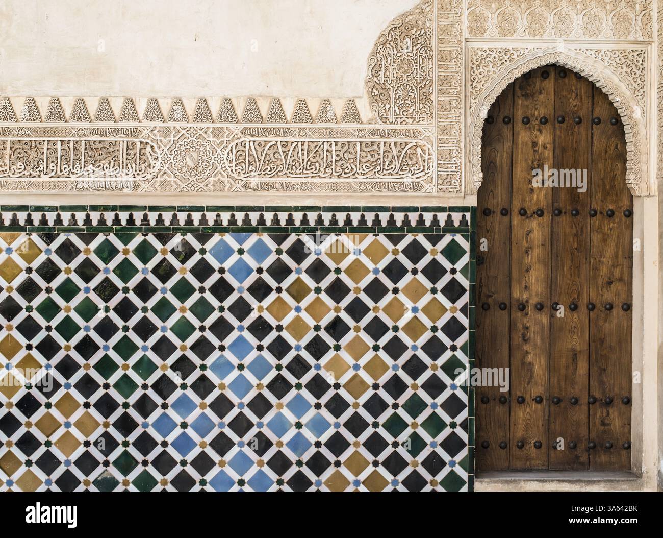 Islamic ornaments on wall. Arab symbols. Wooden door Stock Photo - Alamy