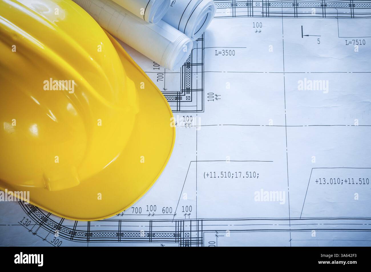 Protective building helmet construction drawings on blueprint Stock ...