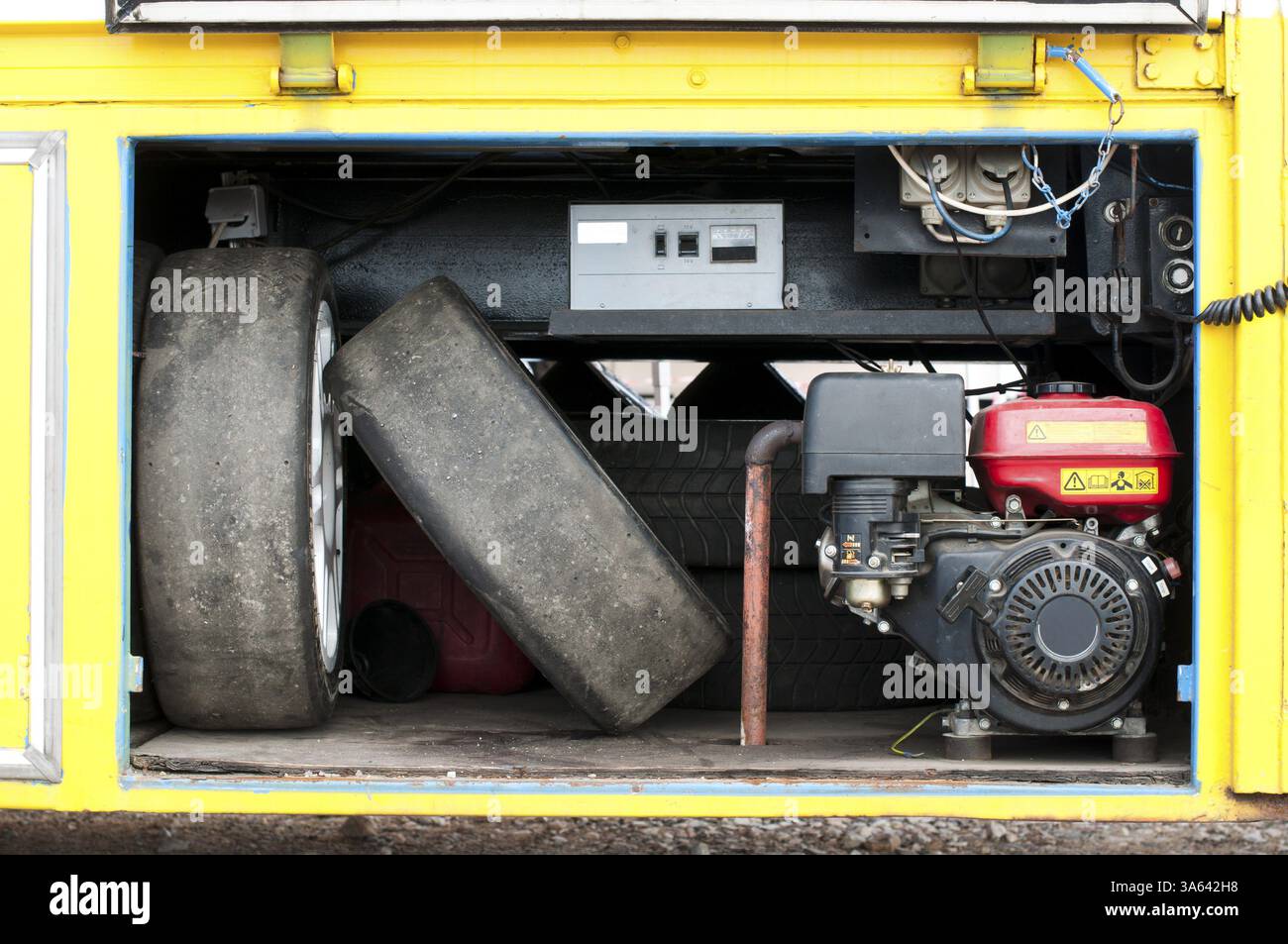 Tires and compressor into a track Stock Photo - Alamy