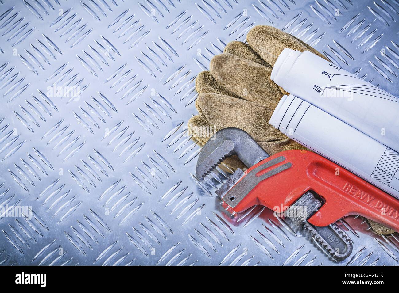Pipe wrench engineering drawings leather safety gloves on fluted metal ...