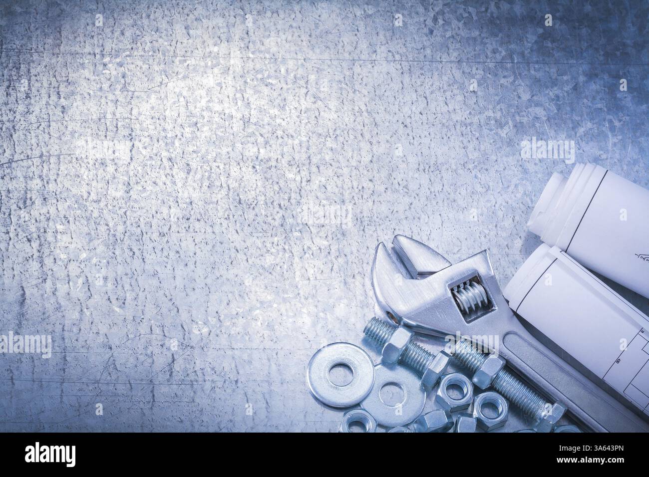 Adjustable wrench bolt washers nuts bolts and rolled up construction ...