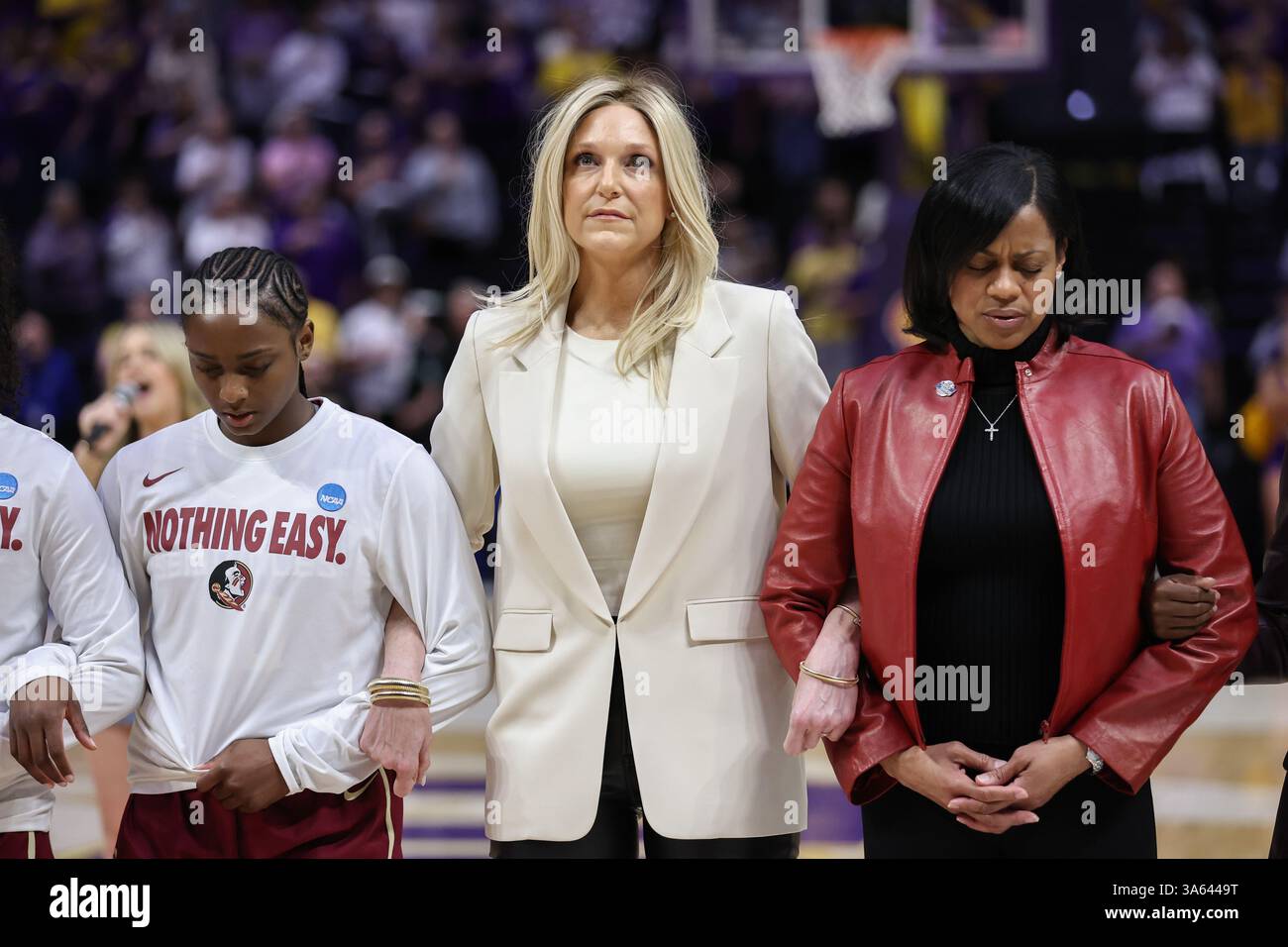 March 24, 2025: Florida St. Head Coach Brooke Wyckoff interlocks arms ...