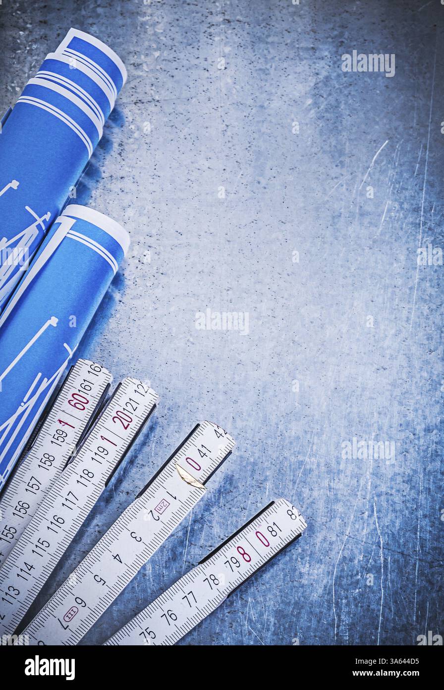 Blue engineering drawings wooden meter on metallic background building ...