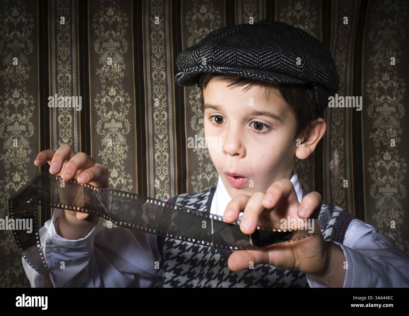 Child considered analog photographic film. Vintage clothes and ...