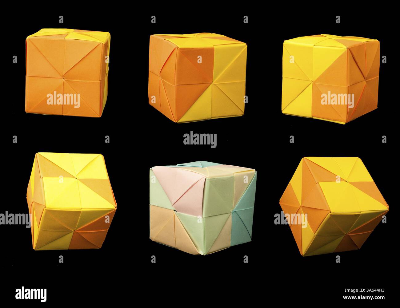 Paper made multi colored patterned cubes folded origami style. Yellow ...