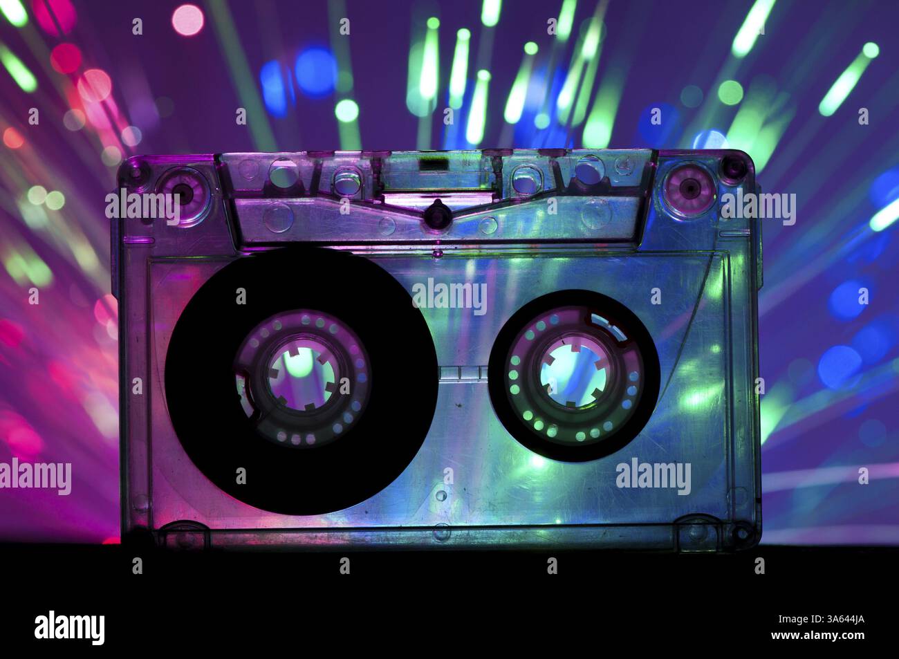 Transparent Cassette tape and blue pink color disco light background ...