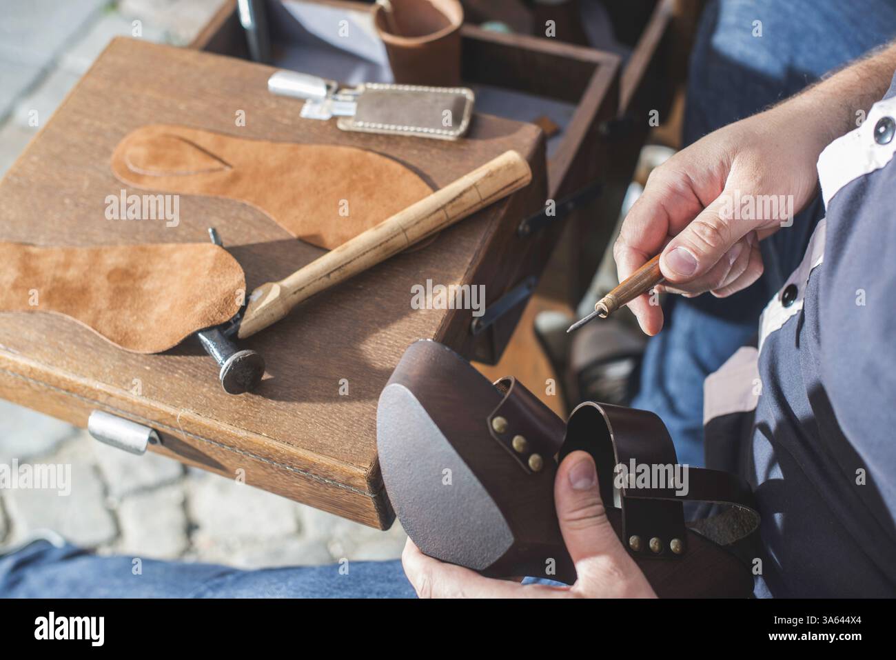Hands making shoes. Shoemaker Stock Photo - Alamy