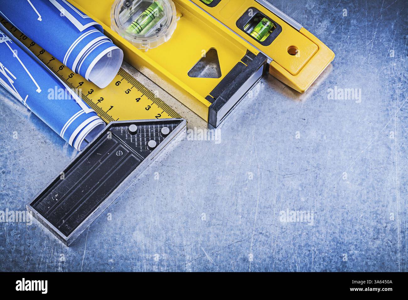 Blue engineering drawings construction levels square ruler on metallic ...