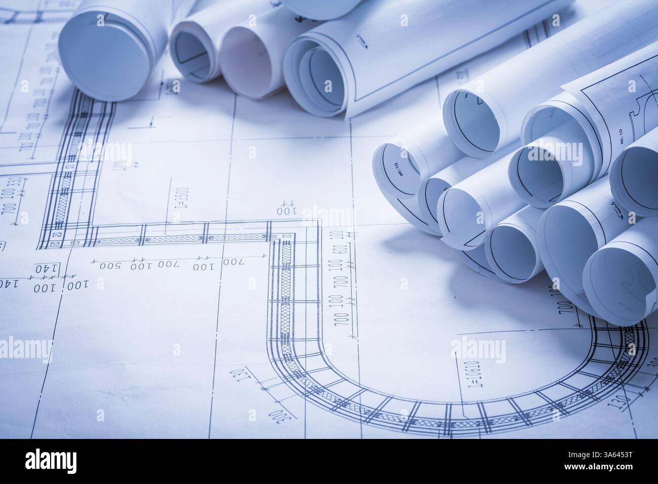 Collection of blueprint rolls construction concept Stock Photo - Alamy