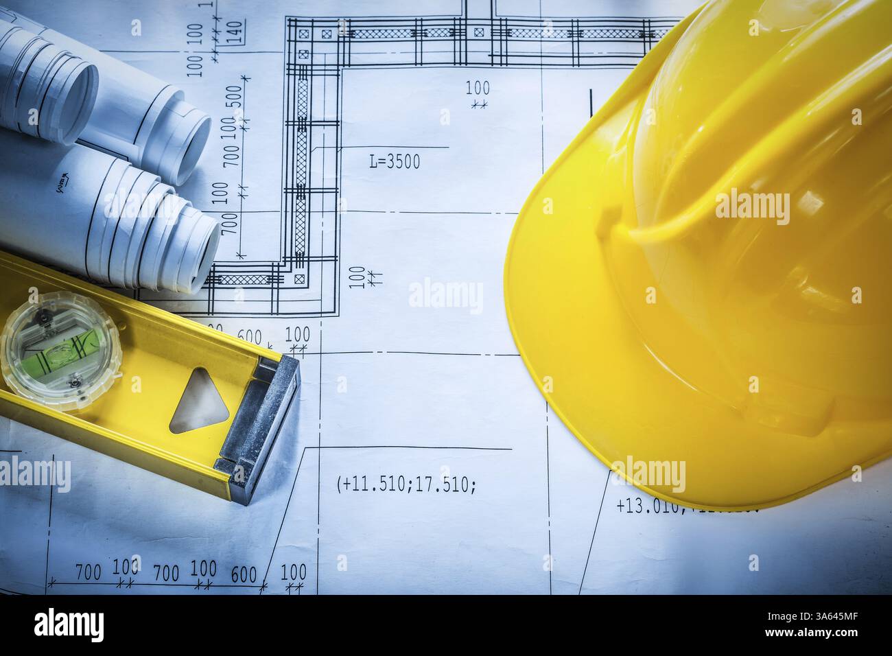 Building helmet construction level drawings on blueprint Stock Photo ...