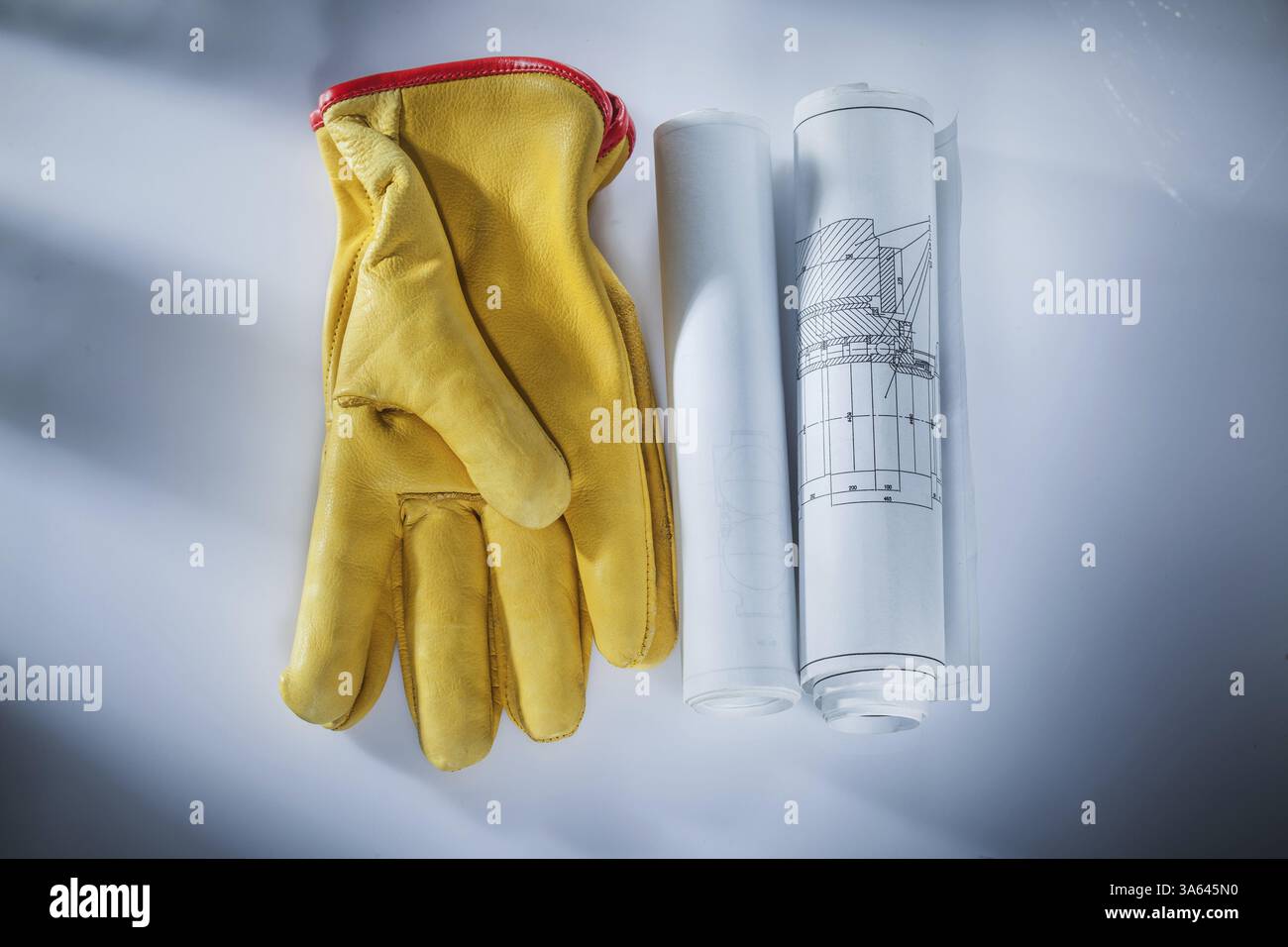 Blueprints protective gloves on white background Stock Photo - Alamy