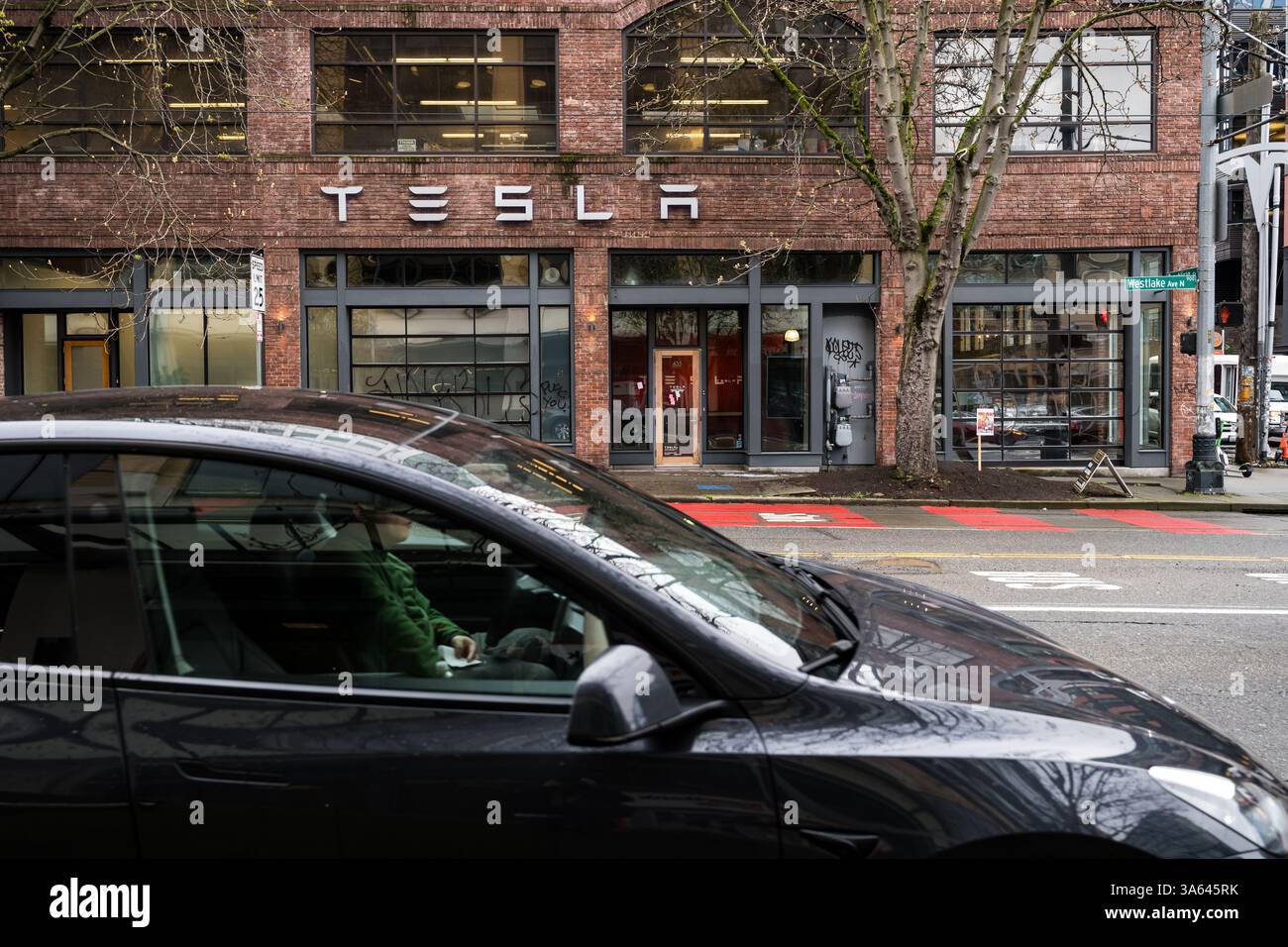 Seattle, USA. 24th Mar 2025. Graffiti damage at the Tesla South Lake ...