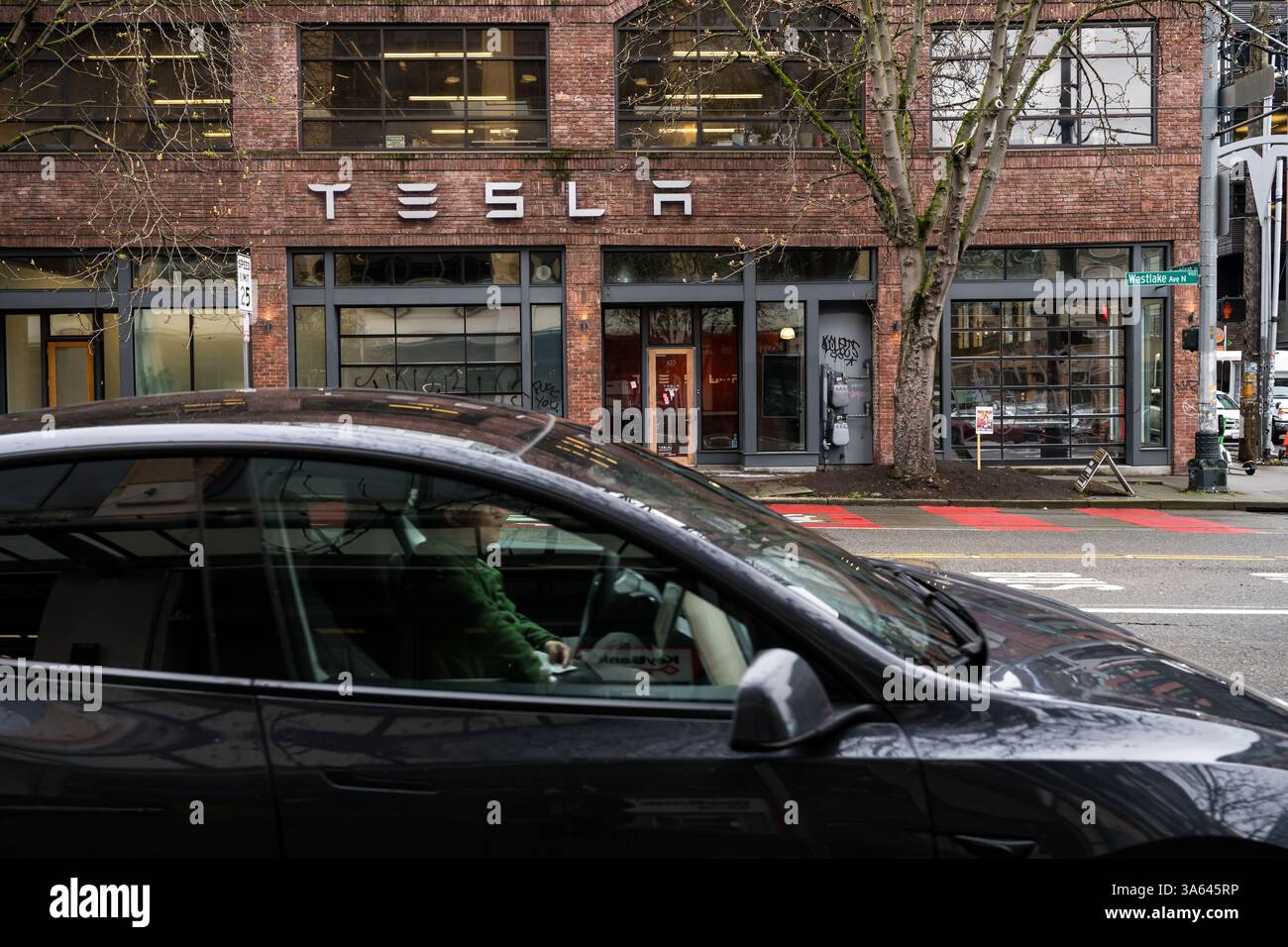 Seattle, USA. 24th Mar 2025. Graffiti damage at the Tesla South Lake ...