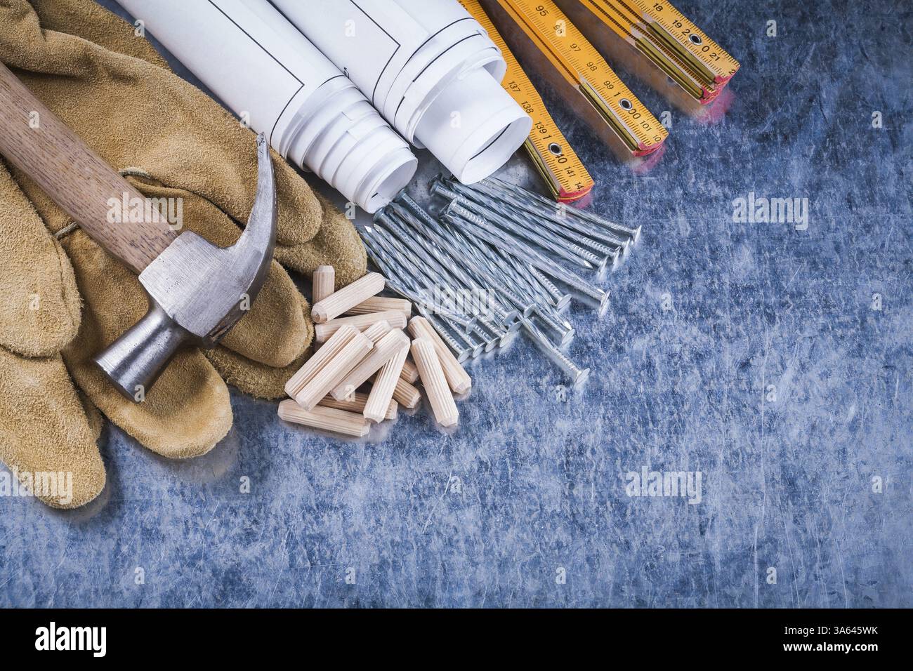 Blueprint rolls claw hammer safety gloves wooden meter metal nails and ...