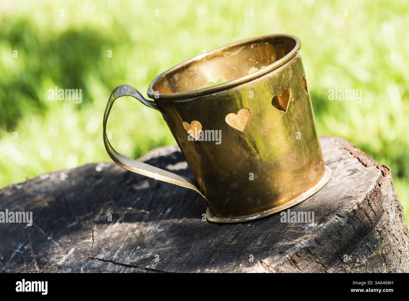 Metal cups with heart shapes Stock Photo - Alamy