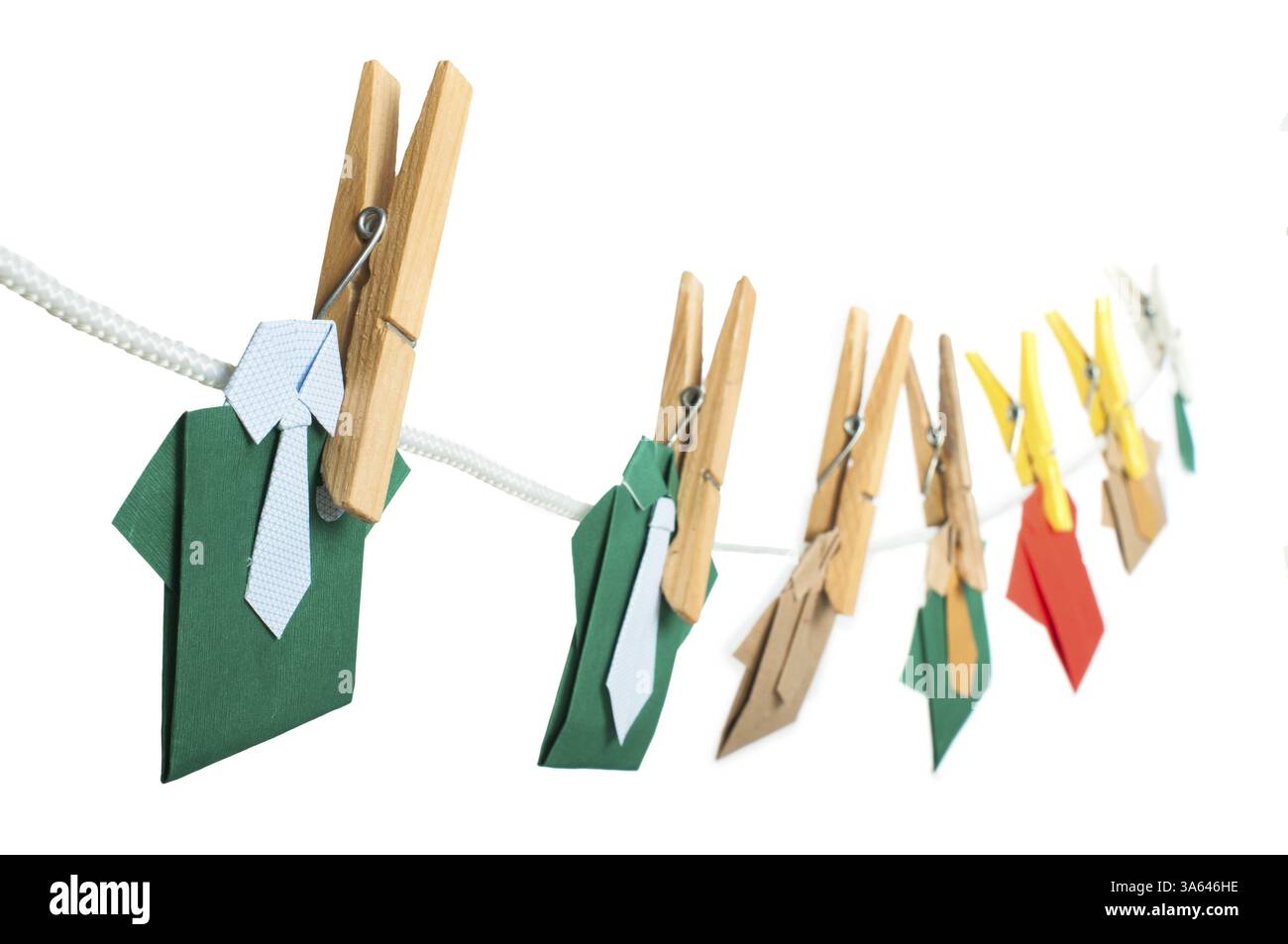 Origami shirts on rope. White isolated Stock Photo - Alamy