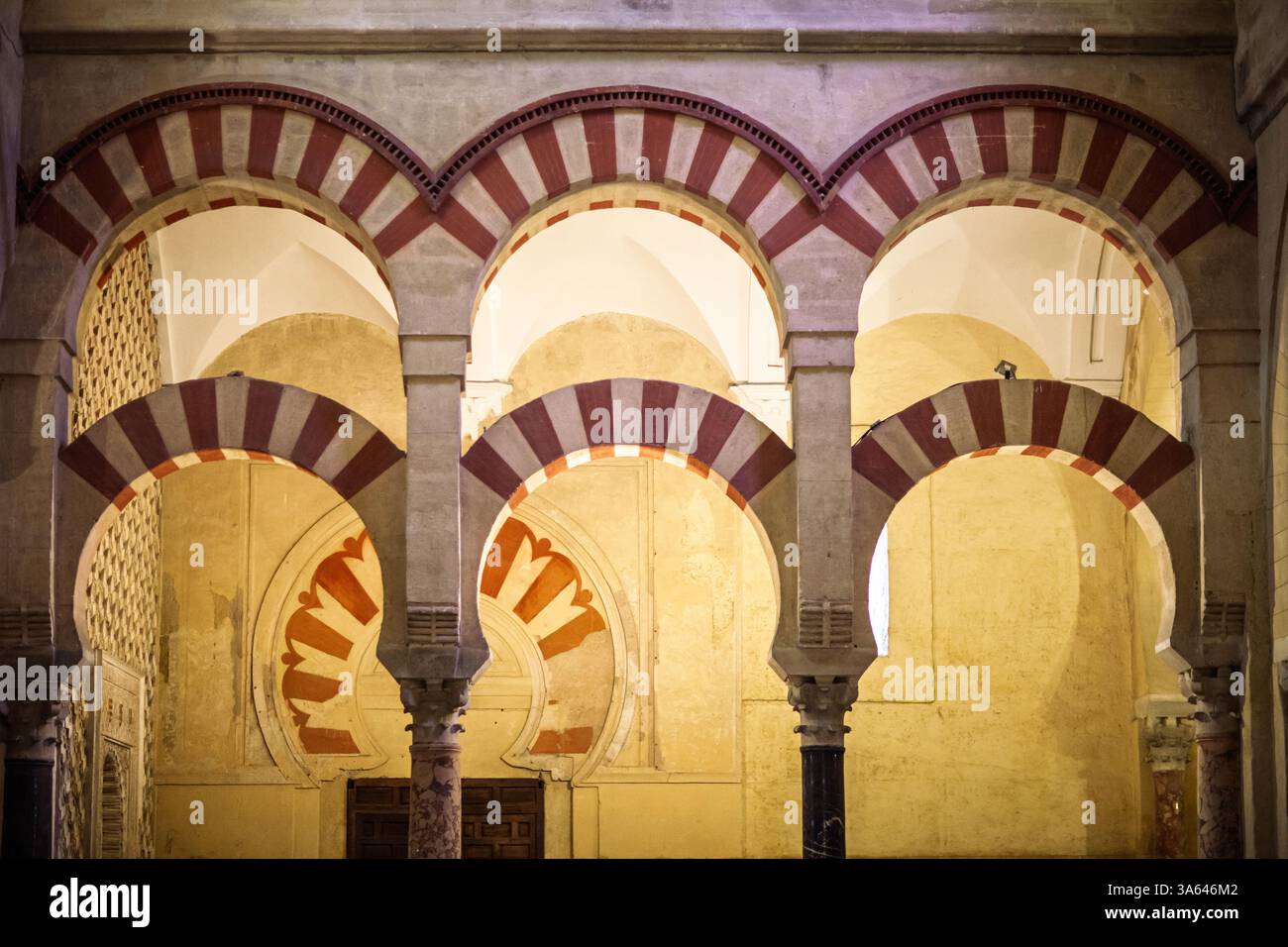 Arches with red and white stripes create a stunning visual in the ...