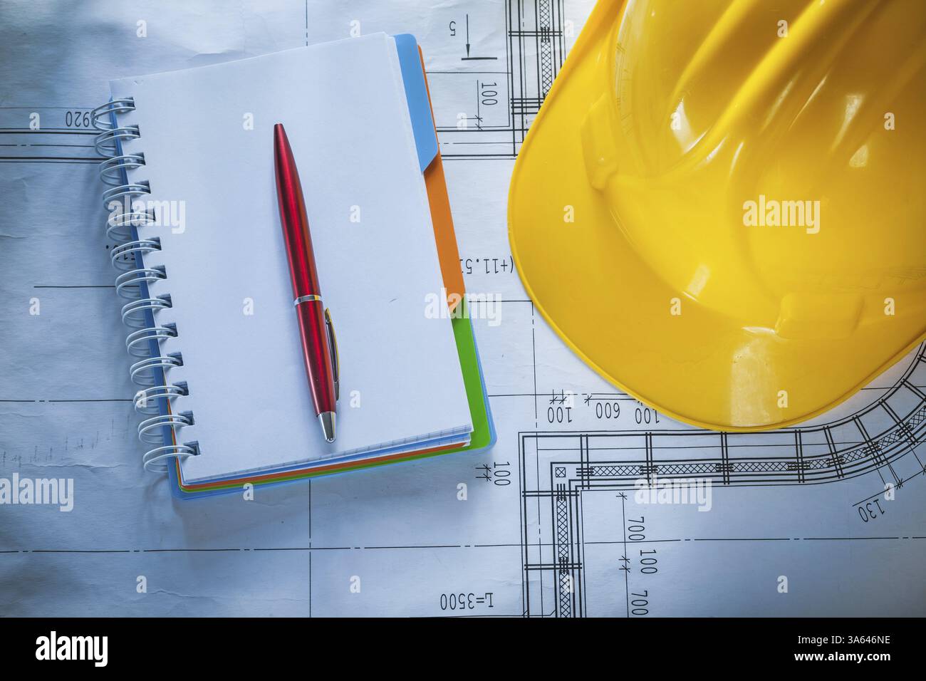 Protective building helmet notepad pen on blueprint Stock Photo - Alamy