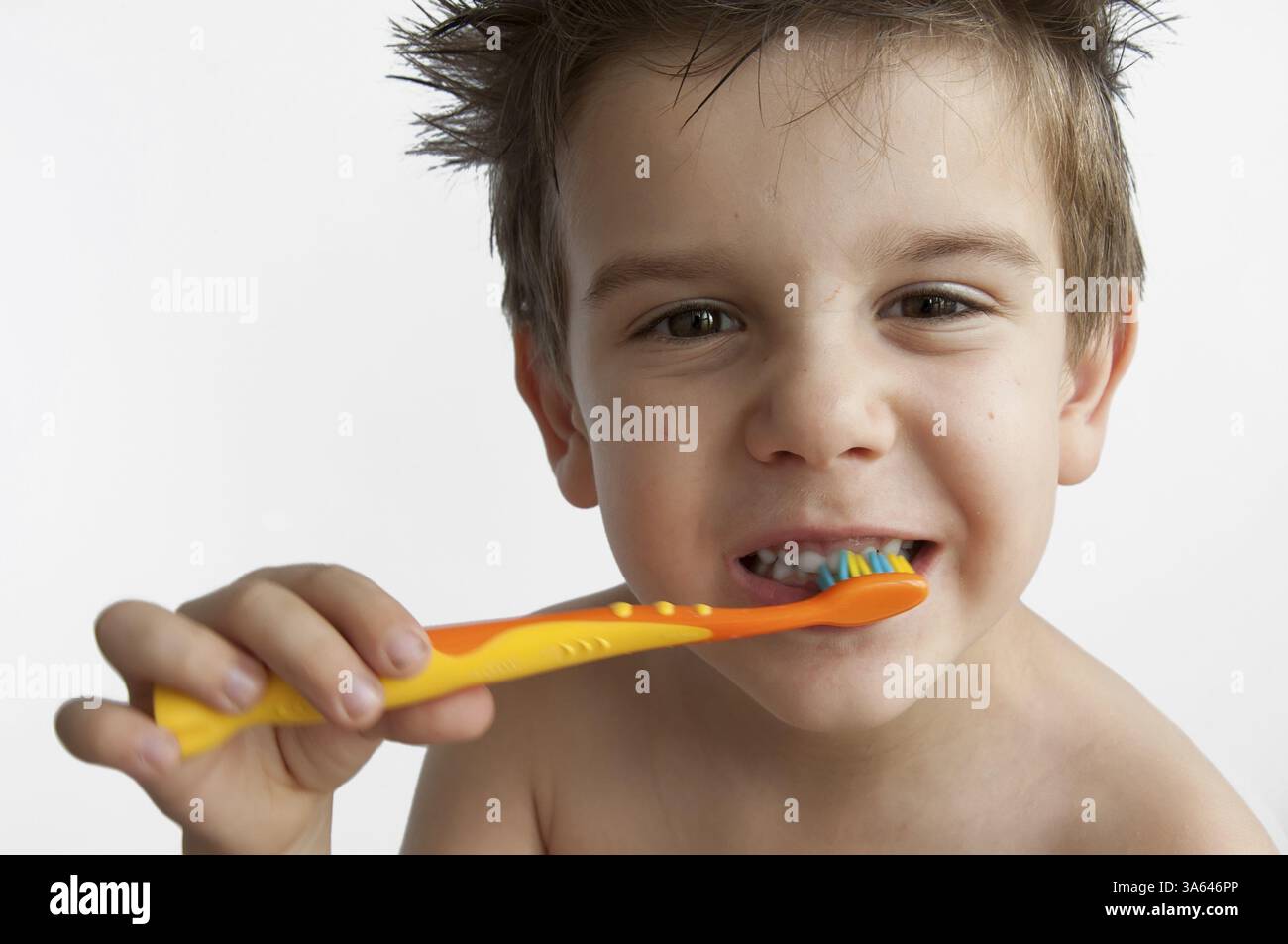 Boy washing teeth with toothbrush Stock Photo - Alamy
