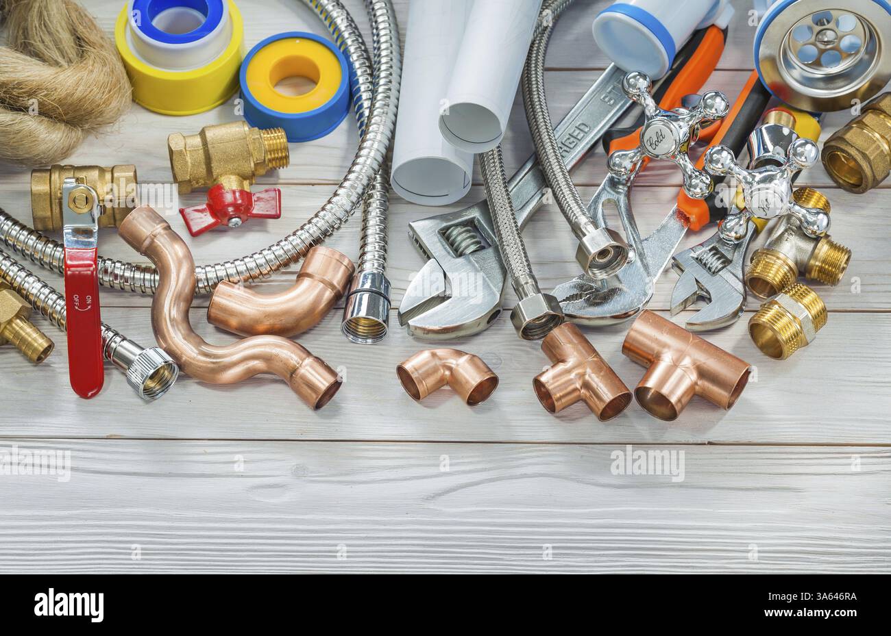 Big set of plumbers tools and accessories on vintage white painted wood ...