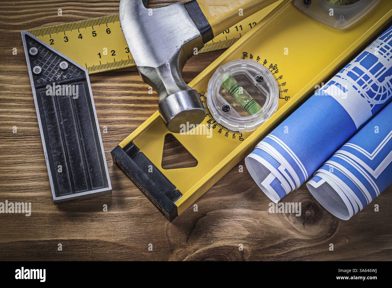 Blue blueprints construction level square ruler claw hammer on wooden ...