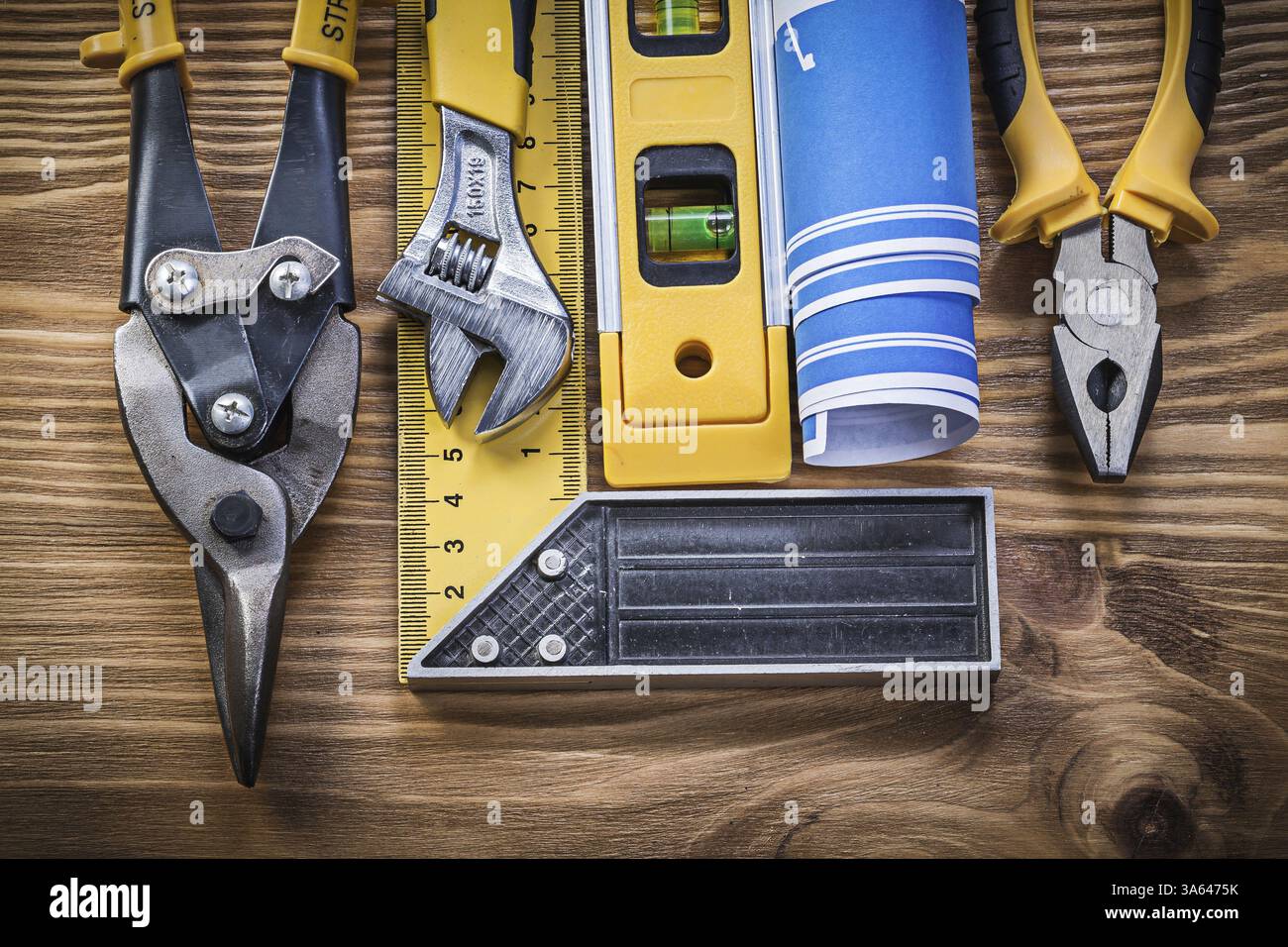 Construction level blueprint try square pliers steel cutter monkey ...