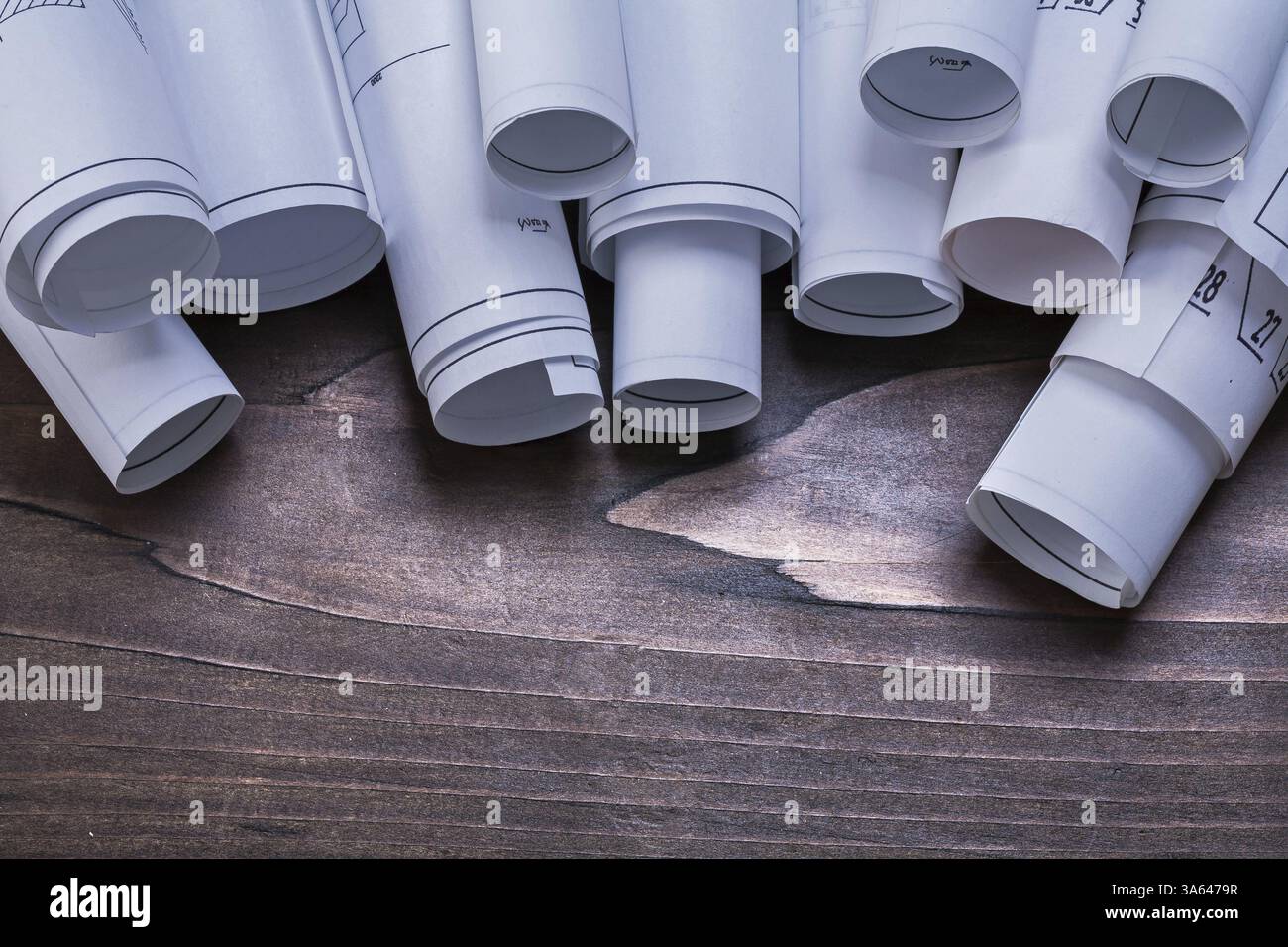 Pine wooden vintage board with stack of construction plans maintenance ...