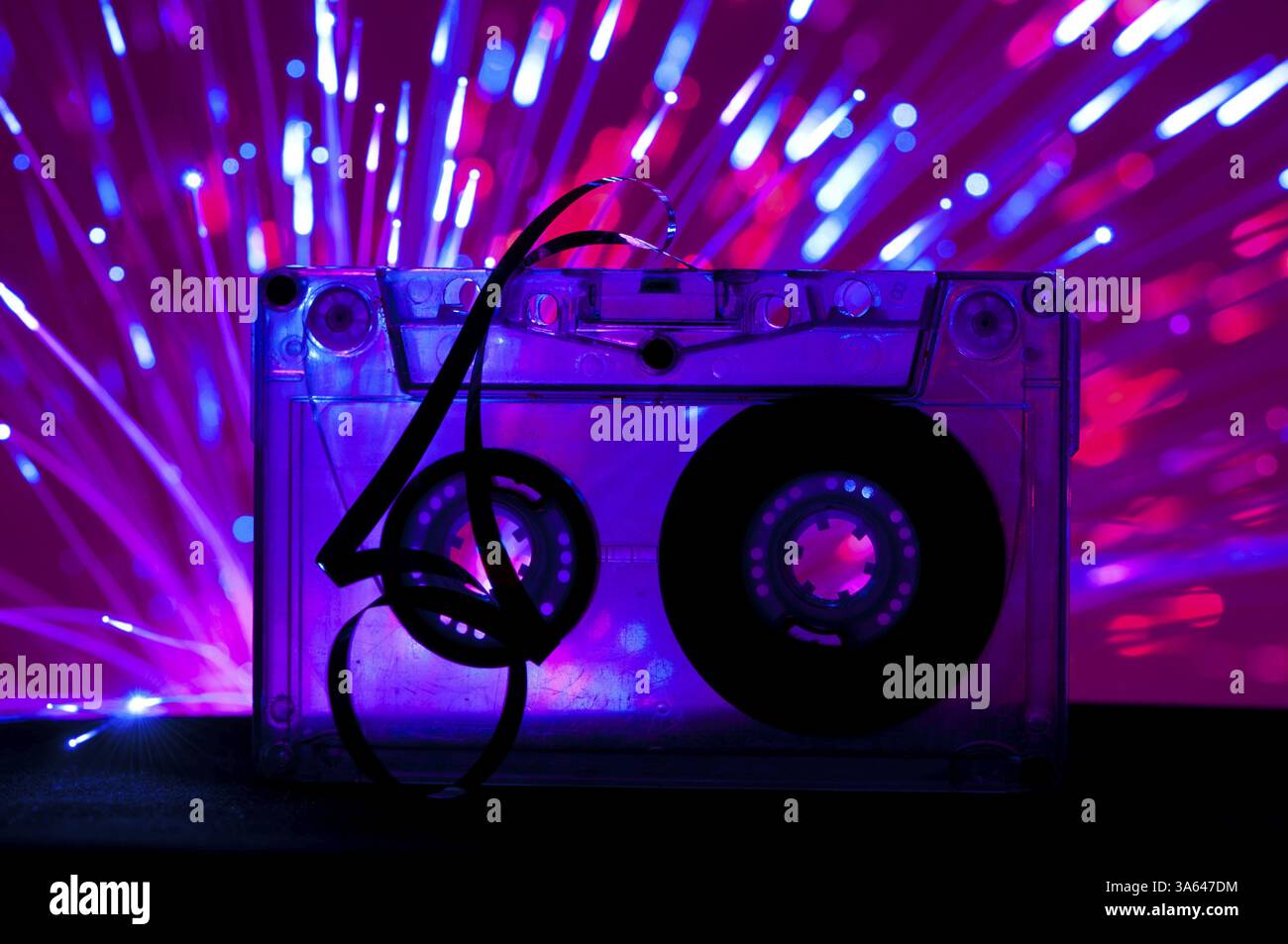 Transparent Cassette tape and blue pink color disco light background ...