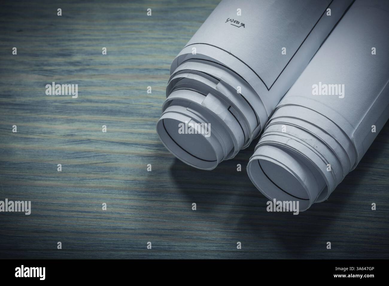Rolled blueprints close up Stock Photo - Alamy