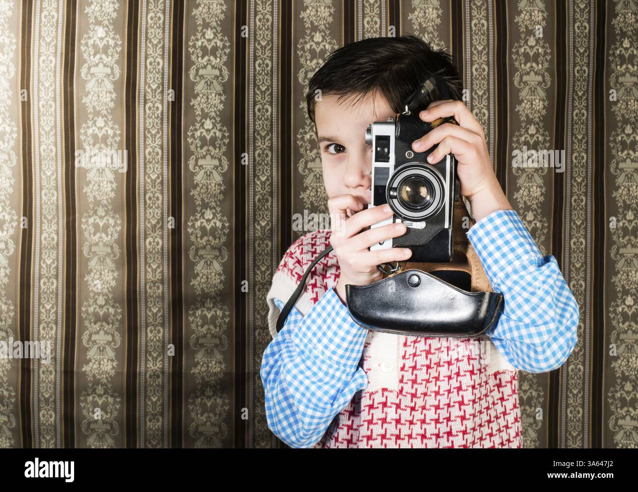Boy with vintage camera. Vintage clothes Stock Photo - Alamy