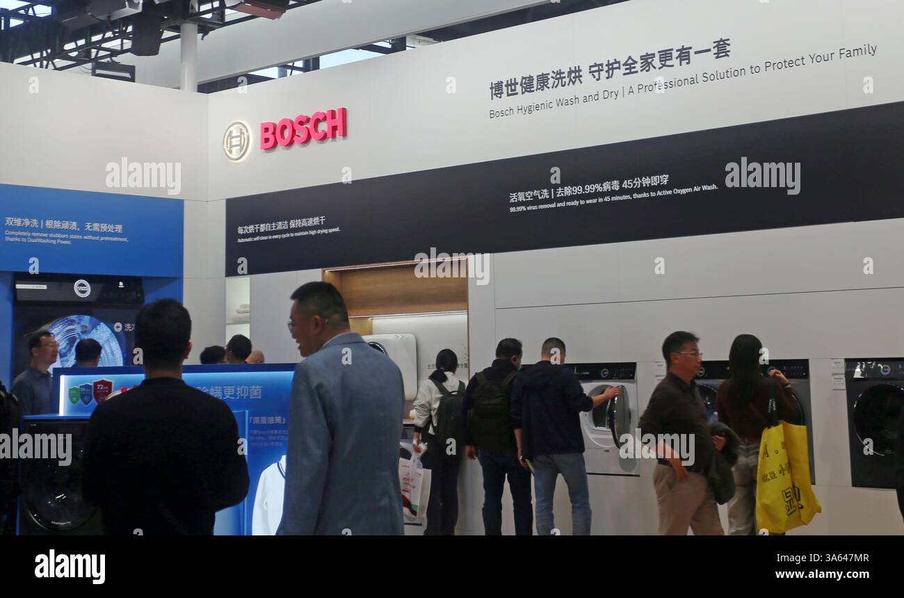 SHANGHAI, CHINA - MARCH 20, 2025 - Visitors look at the booth of German ...