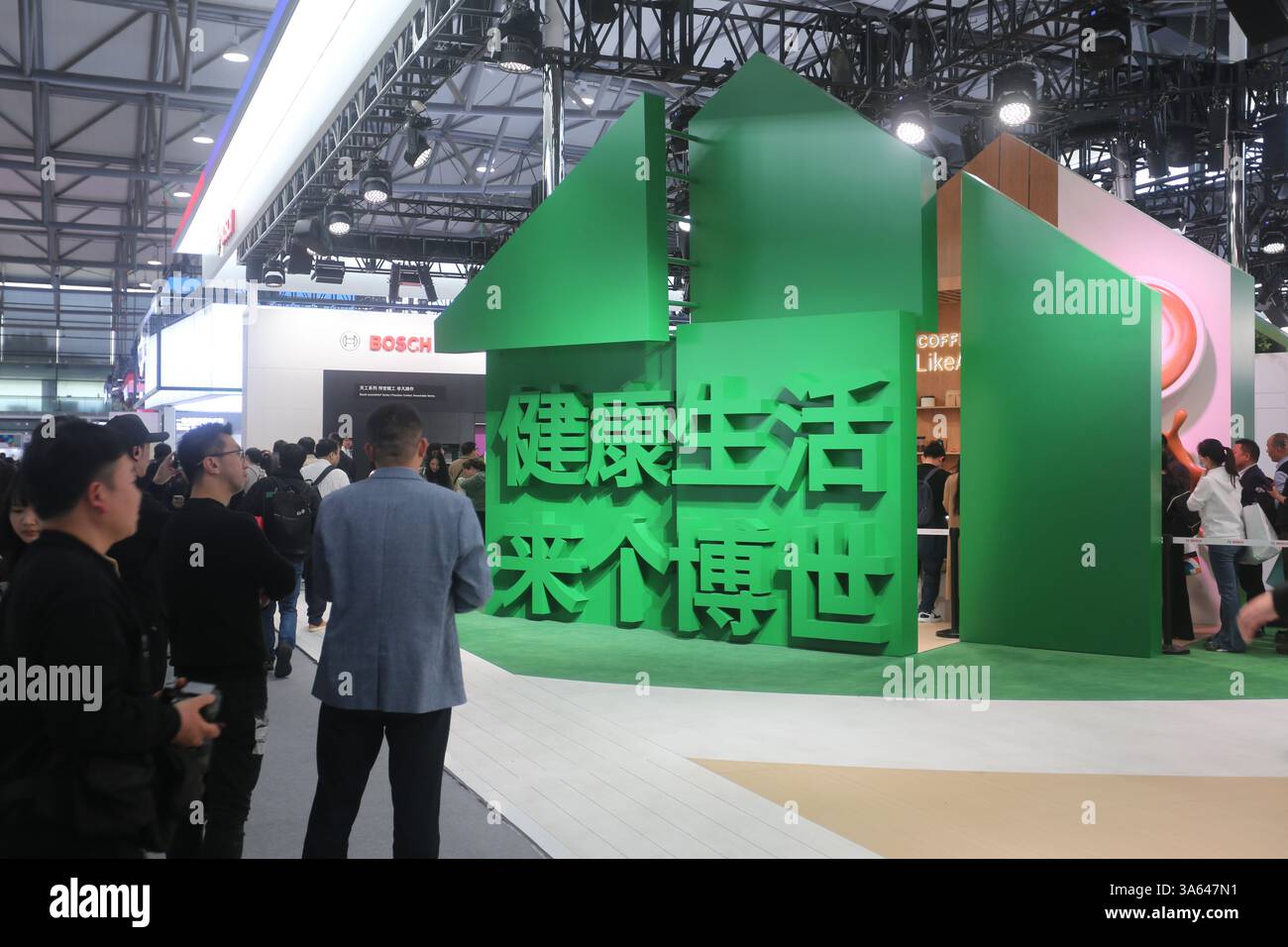 SHANGHAI, CHINA - MARCH 20, 2025 - Visitors look at the booth of German ...