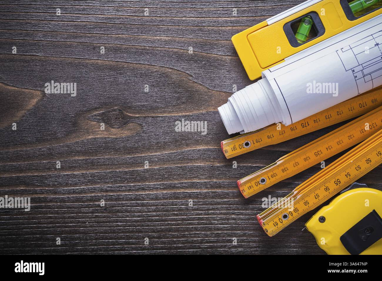 Blueprints construction level tape-measure and wooden meter on vintage ...