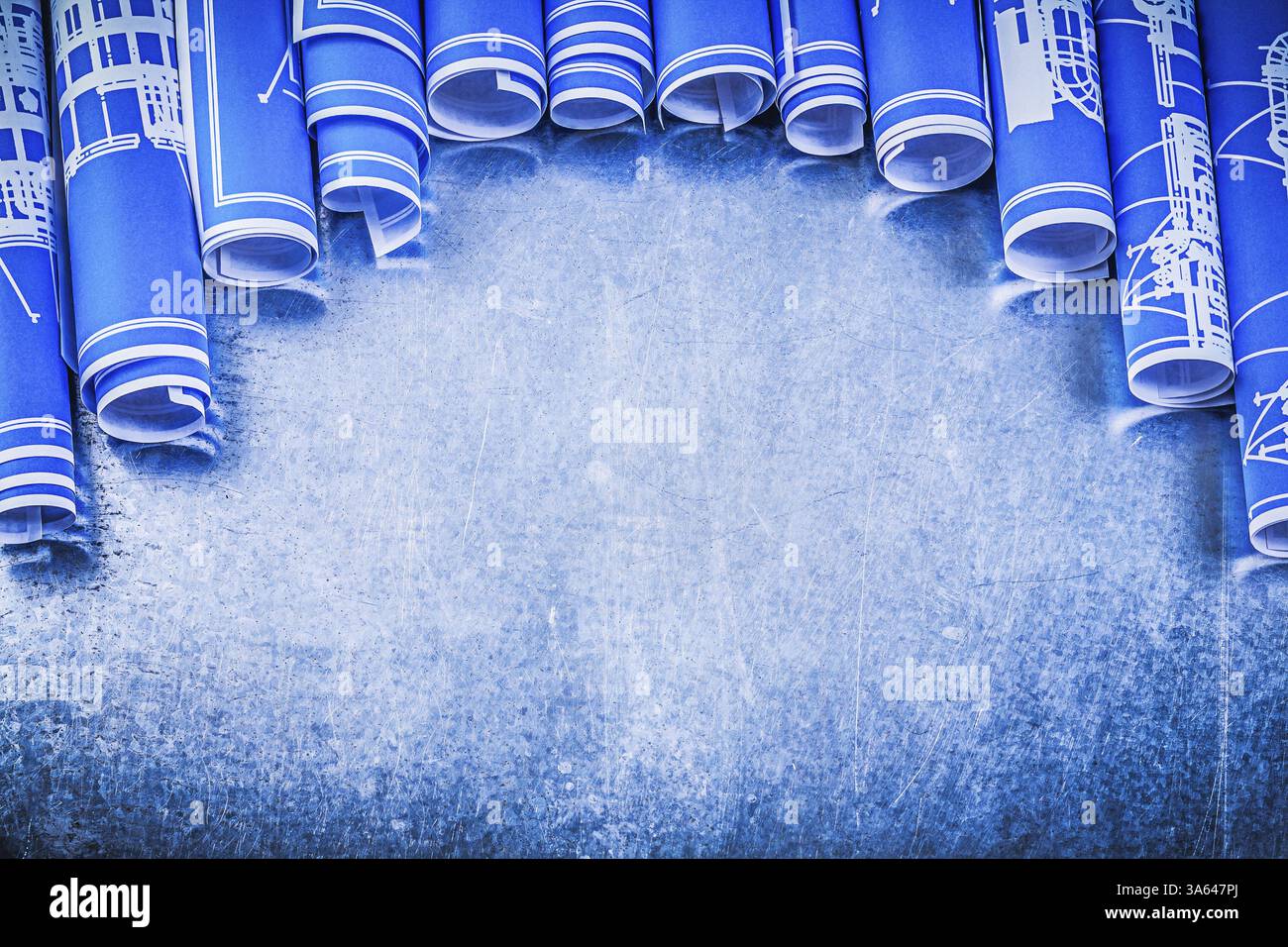 Blue engineering drawings on metallic background construction concept ...