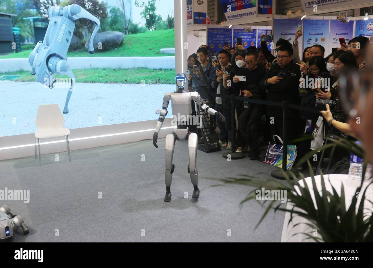 SHANGHAI, CHINA - MARCH 20, 2025 - Visitors visit UNITREE G1 humanoid ...