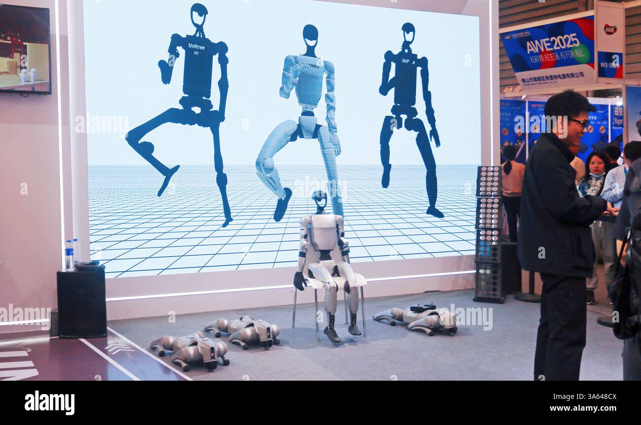 SHANGHAI, CHINA - MARCH 20, 2025 - Visitors visit UNITREE G1 humanoid ...